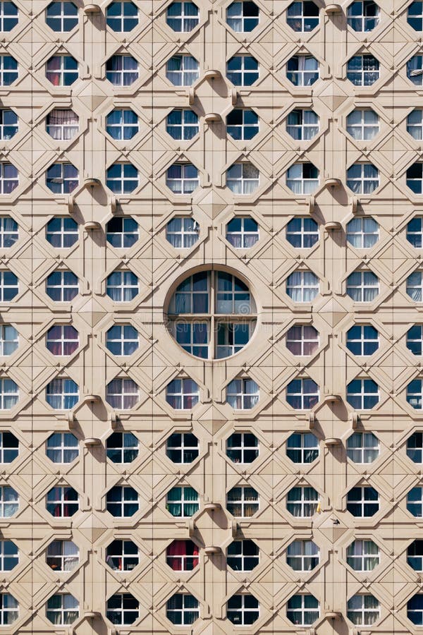 Vertical Shot of Beautiful Windows on a Brown High Rise Building Stock ...