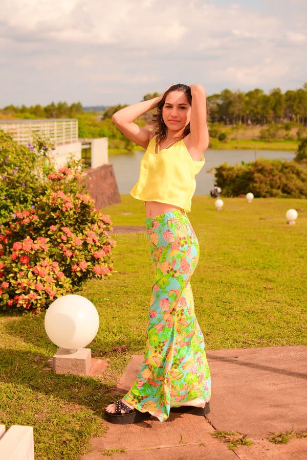 Vertical Shot of a Beautiful, Young Hispanic Lady Posing for a Picture ...