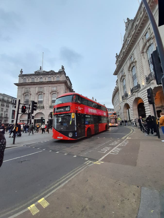 Vertical Shot of a Big Red London Bus in Downtown, UK Editorial Photo ...