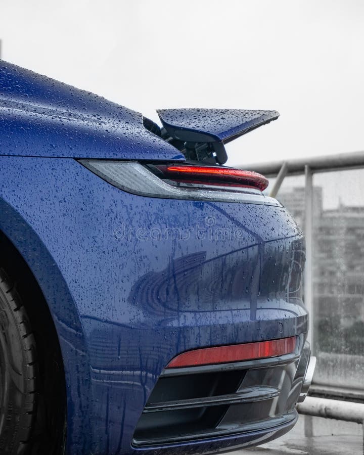 Vertical Shot of a Blue Porsche 911 Carrera S Rear Side View. Editorial ...