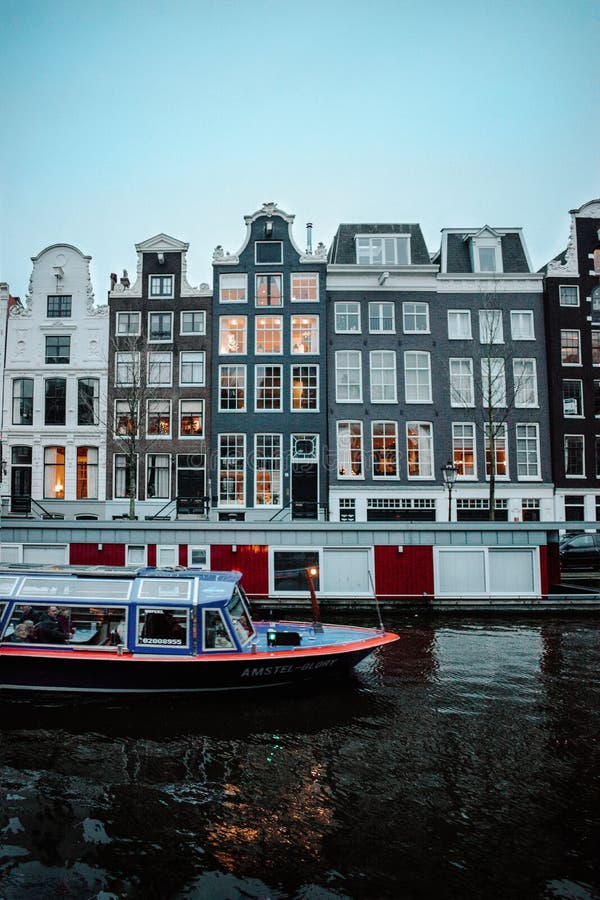 Vertical Shot of the Boat in River with Famous Looking Buildings in ...