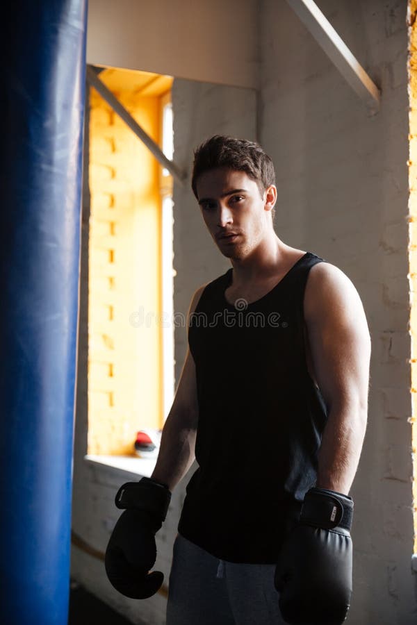 Vertical Shot of Boxer Near Punching Bag Stock Photo - Image of ...