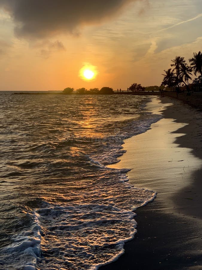 Vertical Shot of a Breathtaking Sunset Scenery in the Beach Stock Photo ...