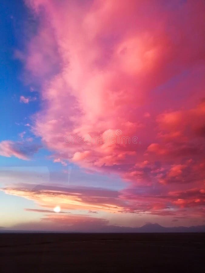 Vertical Shot of Breathtaking Warm Pink Sunset Over the Beach Stock ...