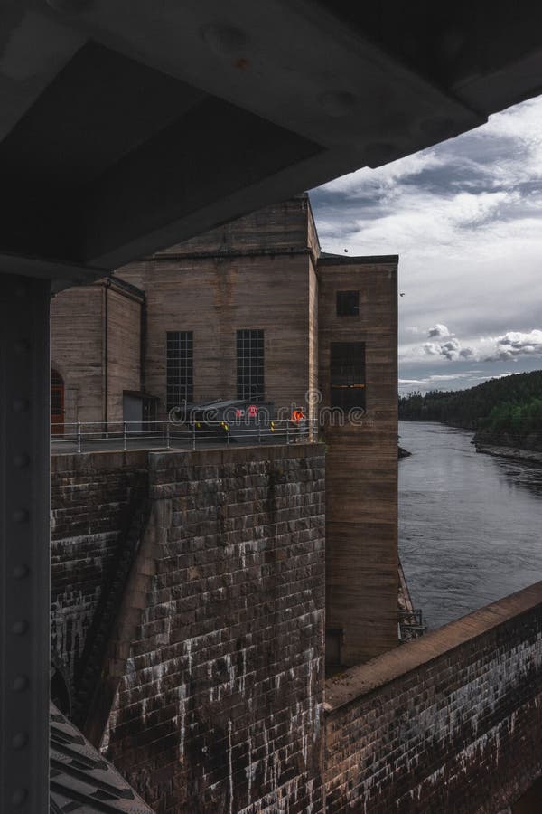 Vertical Shot of a Brick Wall Along a River Stock Image - Image of ...