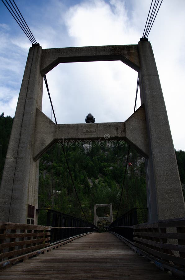 Vertical Shot of a Bridge Connecting Two Sides on a Hill Covered with ...