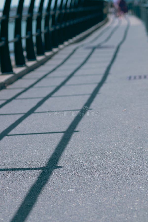 Vertical Shot of the Bridge Deck with the Shadow of the Railing ...