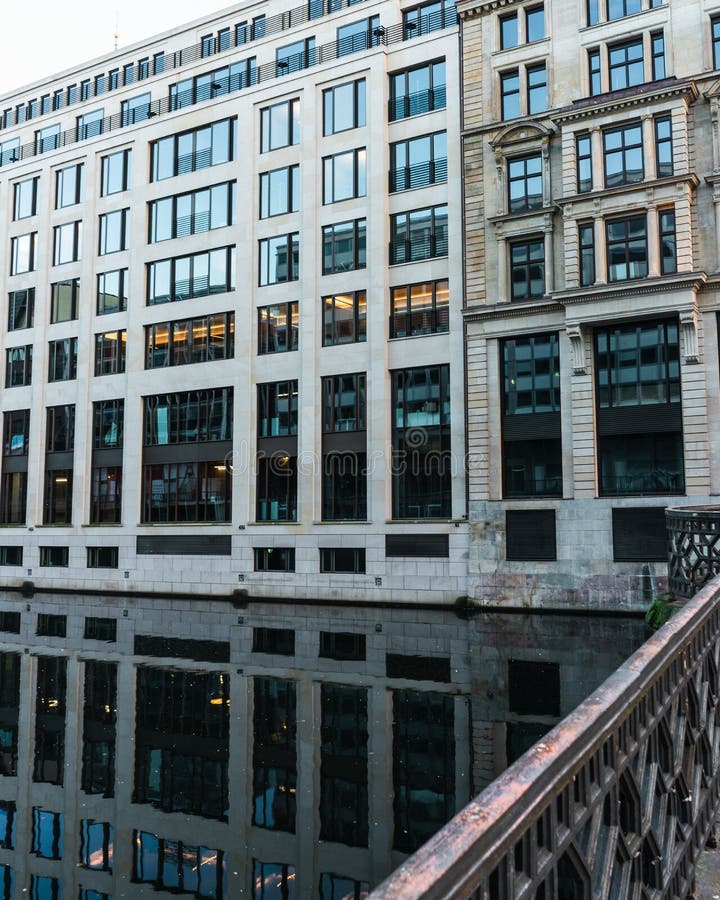 Vertical Shot of a Bridge Over a Canal Near a Modern Building Editorial ...