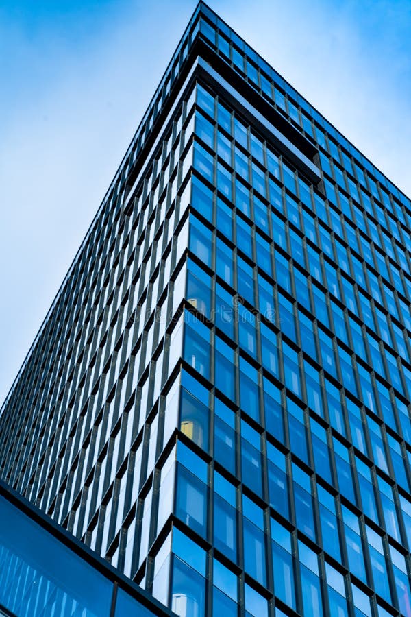 Vertical Shot of a Bright Blue Glass Building Exterior Design Stock ...