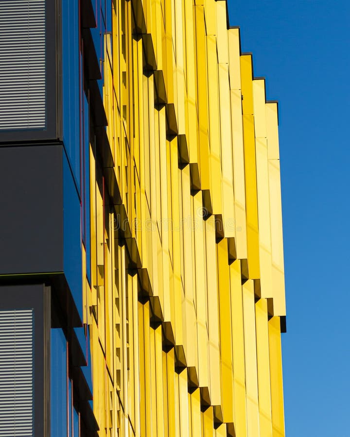 Vertical Shot of a Bright Yellow Reflection on a Modern Mirrored ...