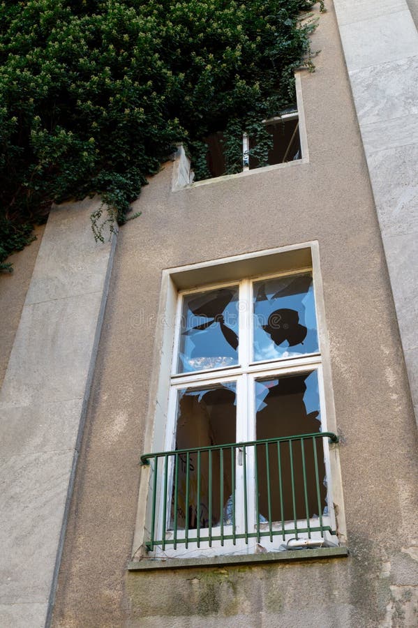 Vertical Shot of a Broken Window of a Building Stock Image - Image of ...