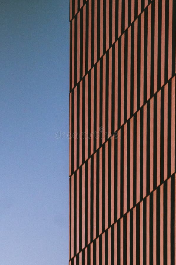 Vertical Shot Of A Building With Red And Black Lines With The ...