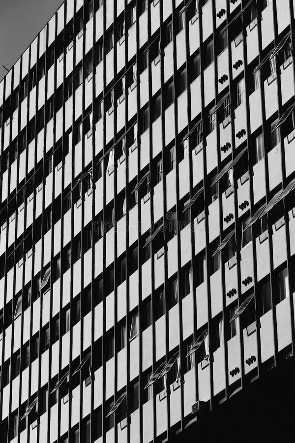 Vertical Shot of a Building Side with Big Open Windows Stock Photo ...