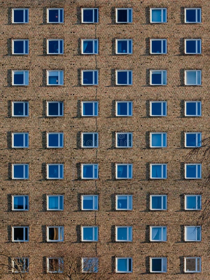 Vertical Shot of a Building with Square Windows Under the Sunlight at ...