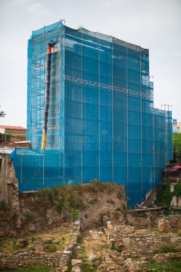 Vertical Shot of a Building that is Under-construction Covered in ...