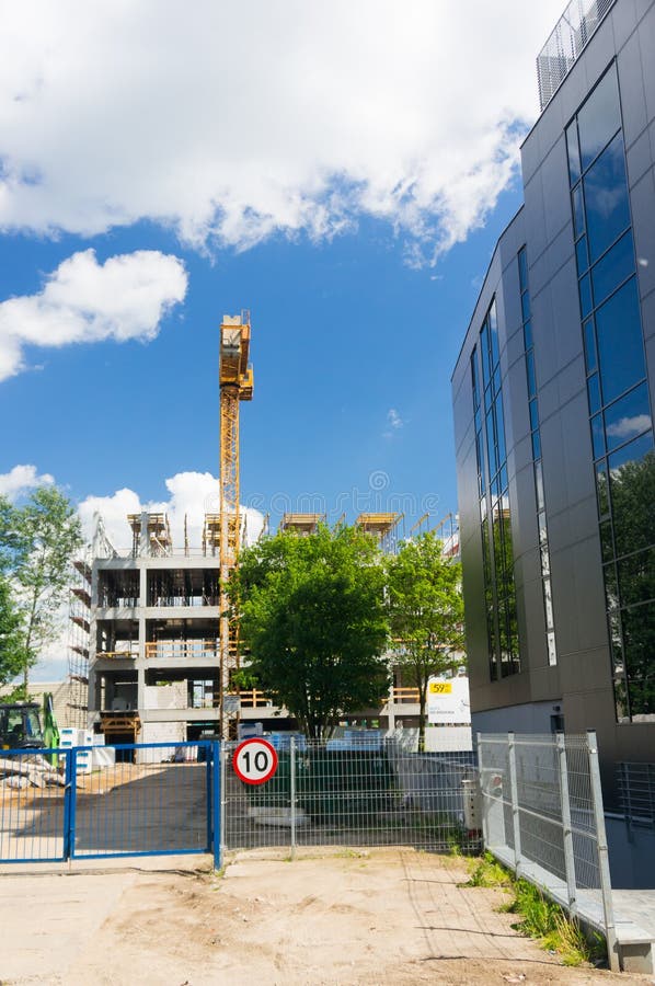 Vertical Shot of a Building Under Construction Next To an Office ...