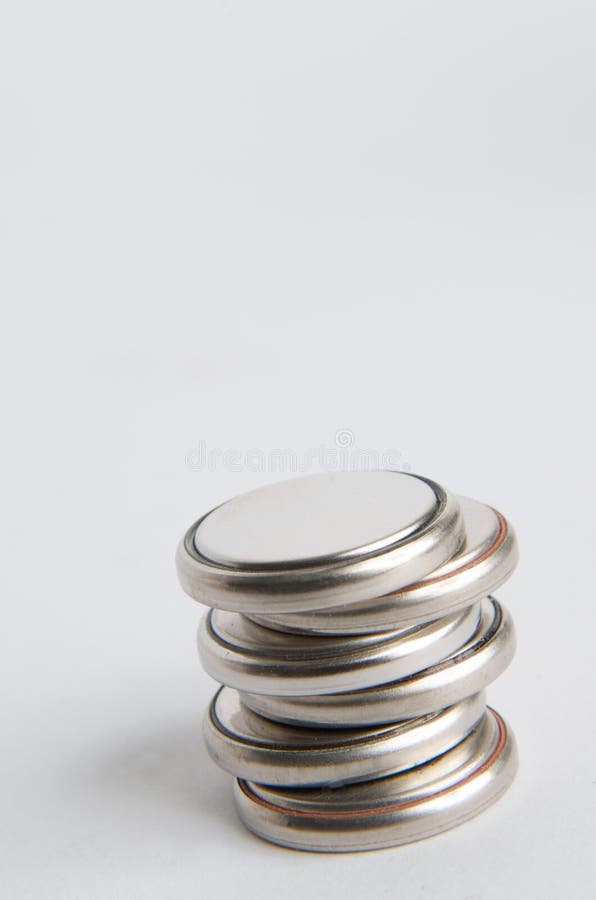 Vertical Shot of Button Cell Batteries on a Plain Background Stock ...