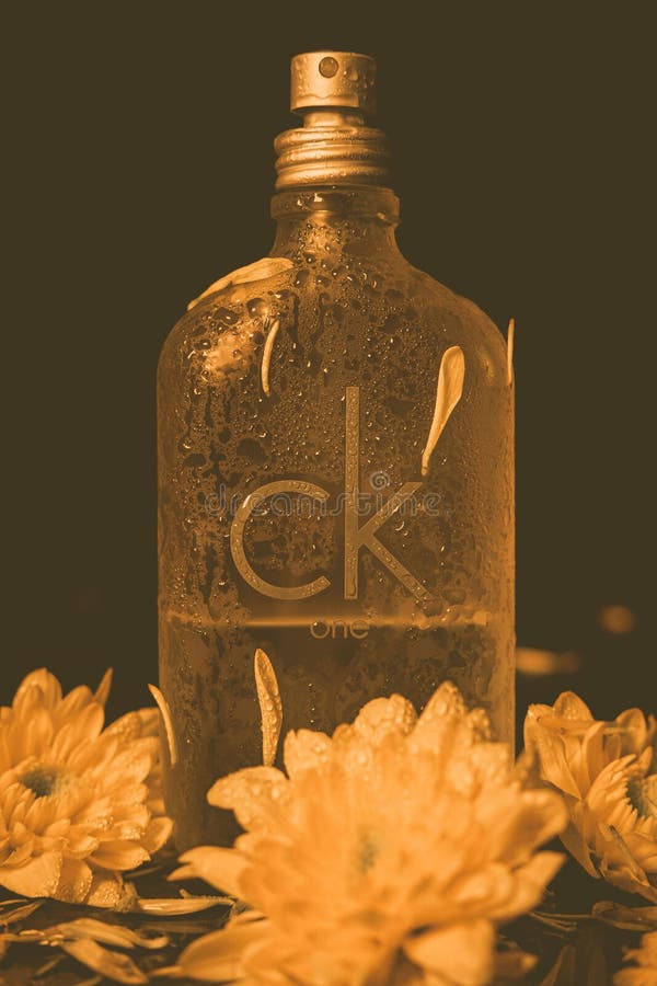 Vertical Shot of the Calvin Klein One Perfume with Flower Decorations ...