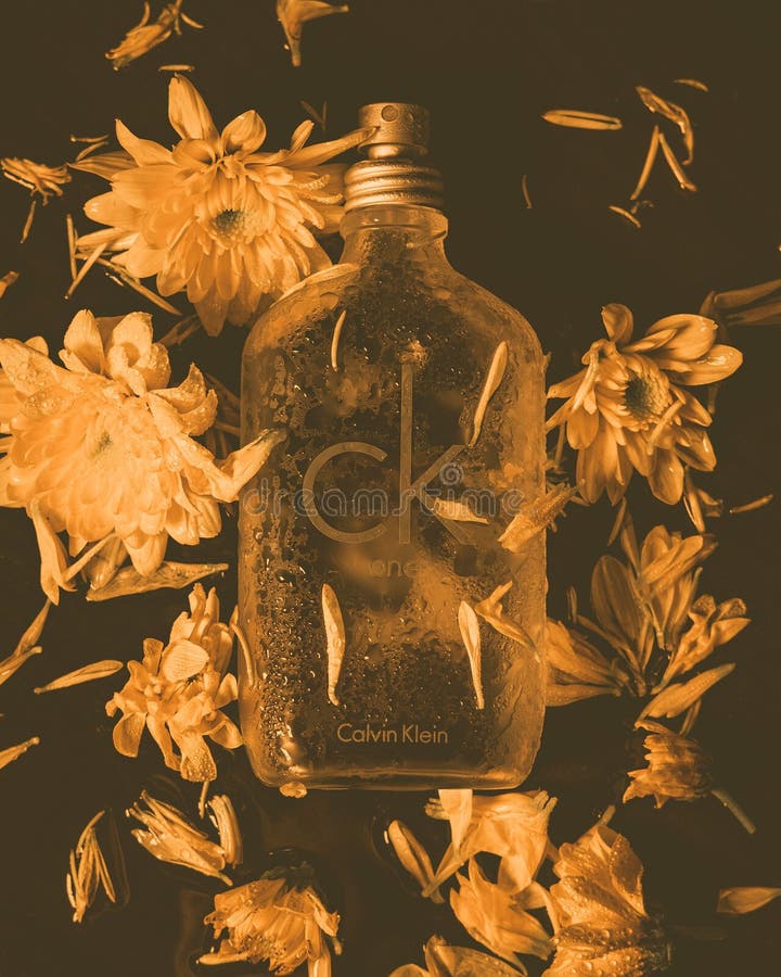 Vertical Shot of the Calvin Klein One Perfume with Flower Decorations ...