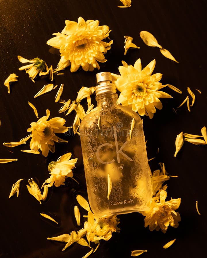 Vertical Shot of the Calvin Klein One Perfume with Flower Decorations ...