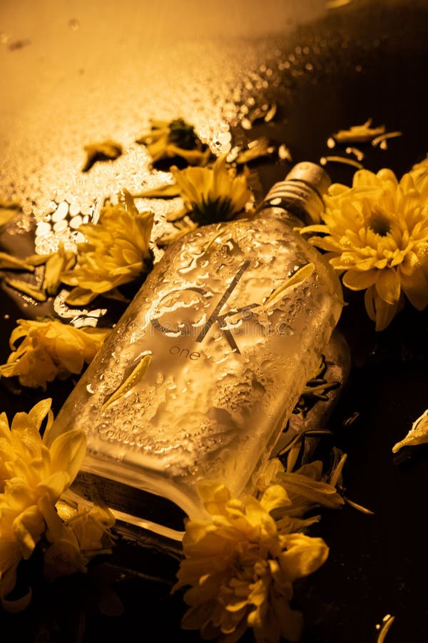 Vertical Shot of the Calvin Klein One Perfume with Flower Decorations ...