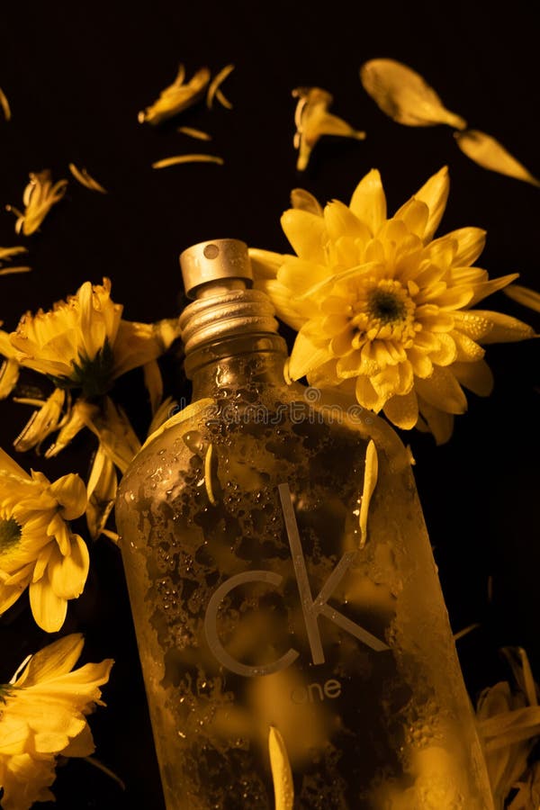 Vertical Shot of the Calvin Klein One Perfume with Flower Decorations ...