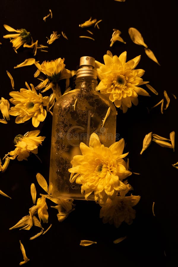 Vertical Shot of the Calvin Klein One Perfume with Flower Decorations ...