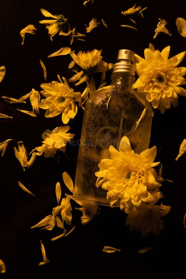Vertical Shot of the Calvin Klein One Perfume with Flower Decorations ...