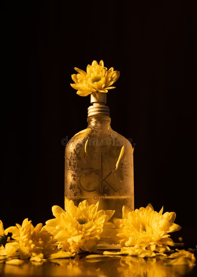 Vertical Shot of the Calvin Klein One Perfume with Flower Decorations ...