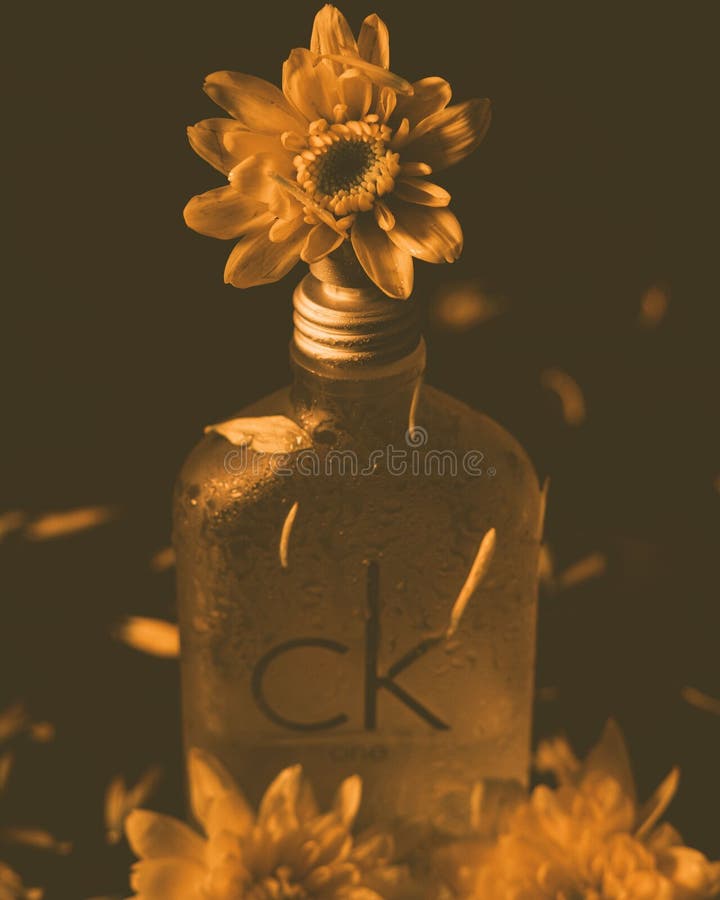 Vertical Shot of the Calvin Klein One Perfume with Flower Decorations ...