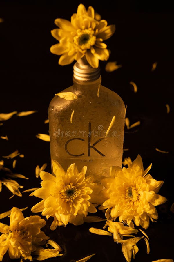 Vertical Shot of the Calvin Klein One Perfume with Flower Decorations ...