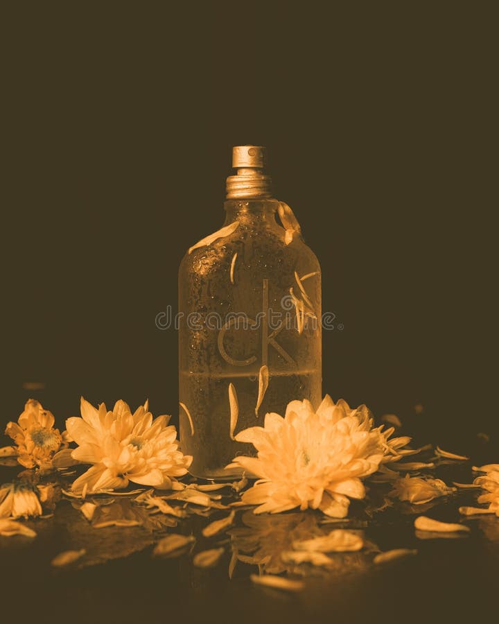 Vertical Shot of the Calvin Klein One Perfume with Flower Decorations ...