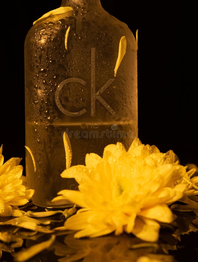 Vertical Shot of the Calvin Klein One Perfume with Flower Decorations ...