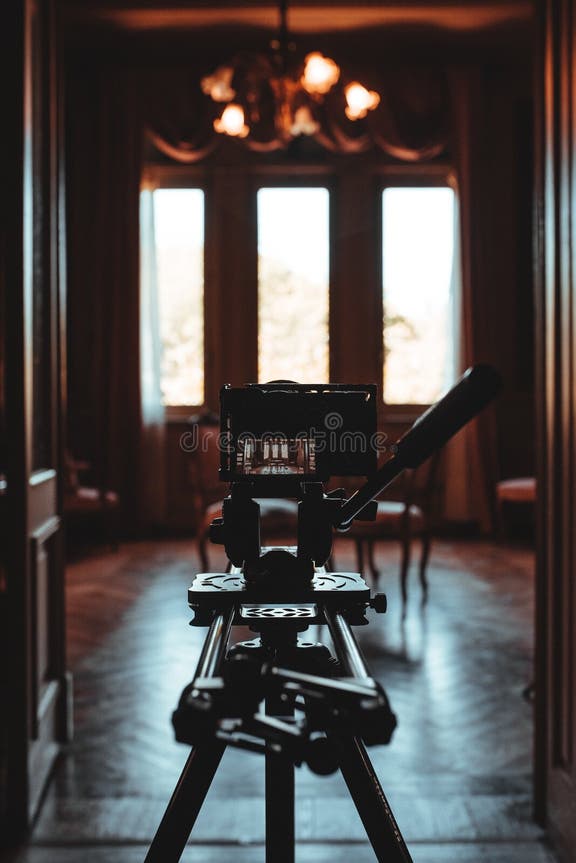 Vertical Shot of a Camera on a Tripod in the Room Stock Photo - Image ...