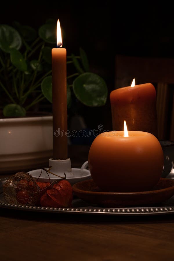 Vertical Shot of Candles with Different Shapes Placed on a Table Stock ...