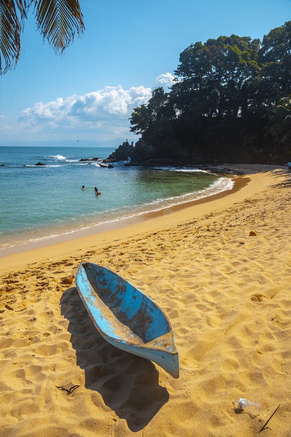 Vertical Shot of a Canoe on the Sand in a Beachside in a Daylight Stock ...