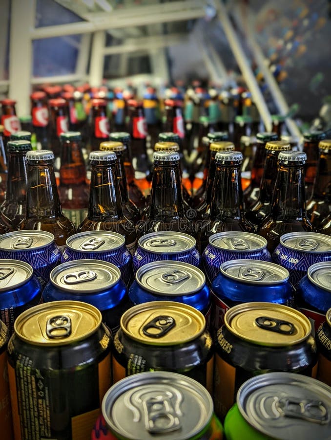Vertical Shot of Cans and Glass Bottles in Rows Stock Image - Image of ...