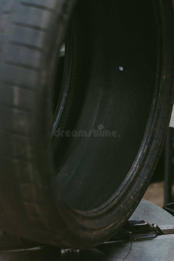 Vertical Shot of a Car Tire without the Rim in a Workshop Stock Image ...