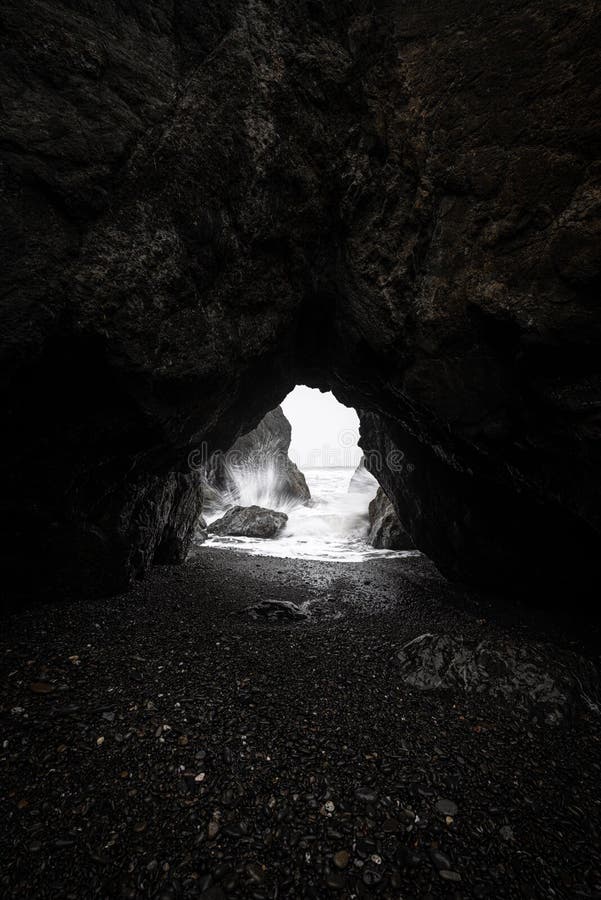 Vertical Shot of a Cave Hole with a View of the Sea. Stock Photo ...