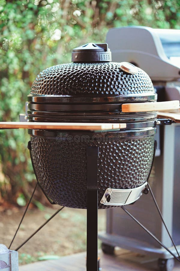 Vertical Shot of a Ceramic Grill in the Yard Stock Image - Image of ...