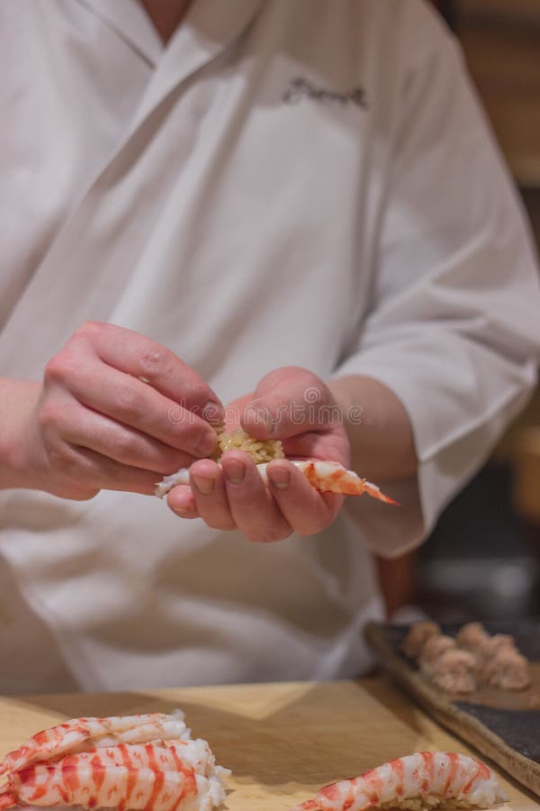 Vertical Shot of Chefs Hands Making Sushi Stock Image - Image of fillet ...