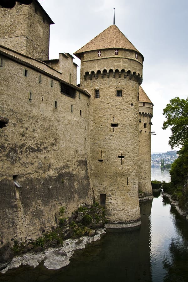 Vertical Shot of the Chillon Castle Near the Sea with a Cloudy Sky in ...