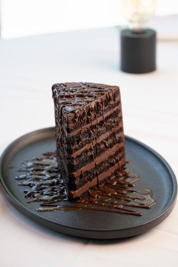 Vertical Shot of Chocolate Layer Cake at Fine Dining Restaurant Stock ...