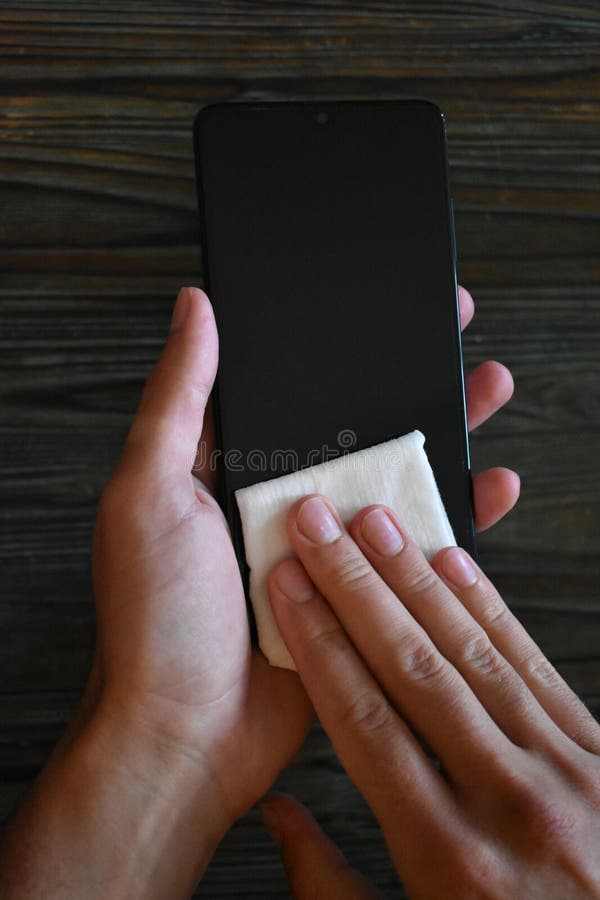 Vertical Shot of Cleaning a Black Phone with a Wipe Stock Image - Image ...
