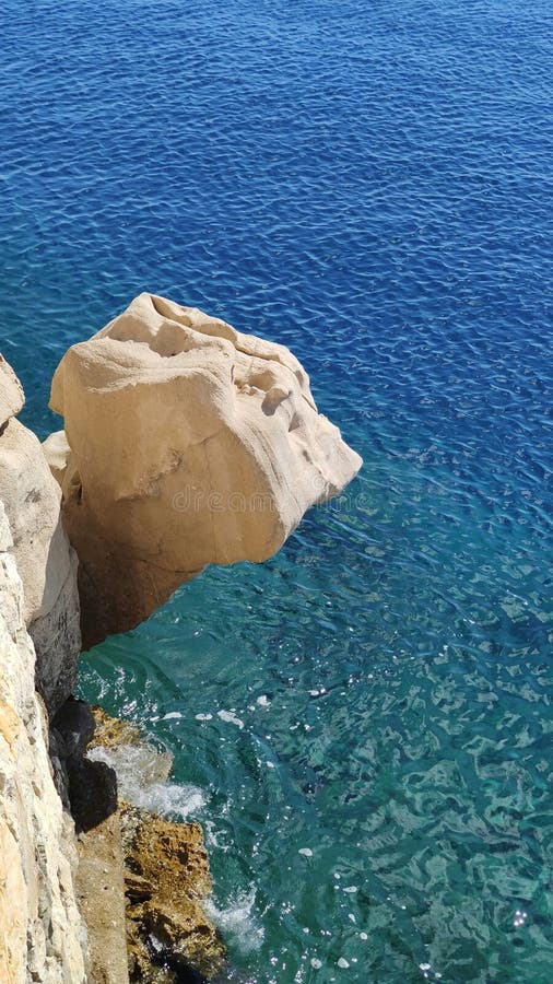 Vertical Shot of a Cliff and Crystal Clear Water Stock Image - Image of ...