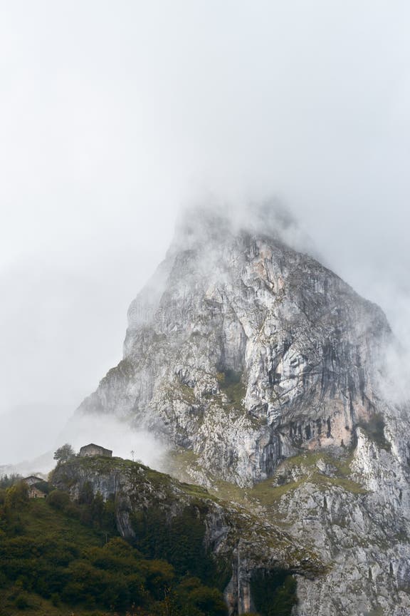 Vertical Shot of a Cliff in a Fog Stock Image - Image of foggy, stone ...