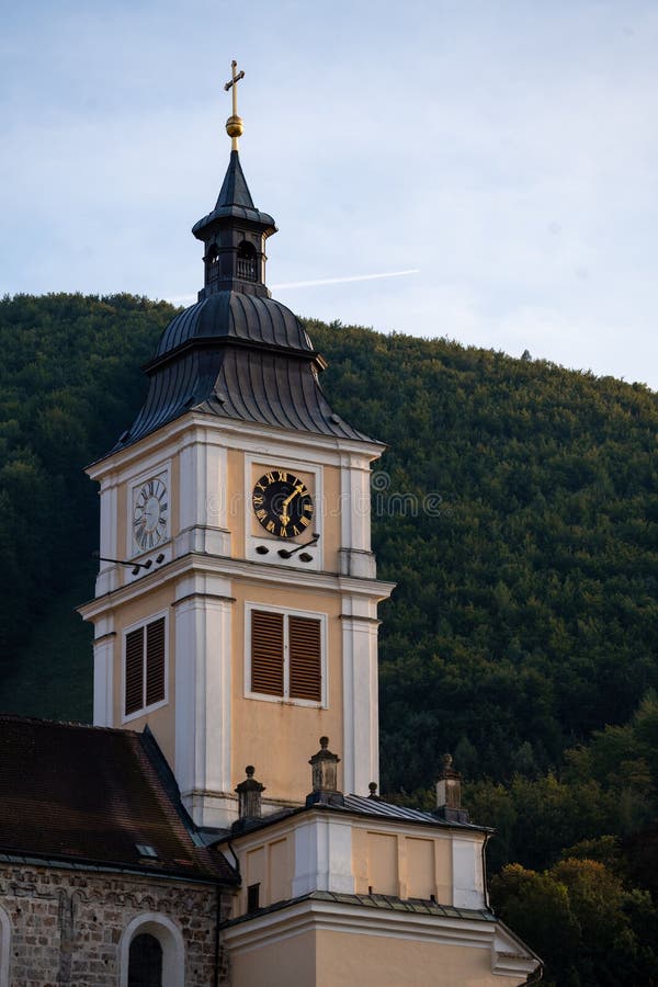 Vertical Shot of a Clock Tower of a Monastery in an Alpine Town in ...