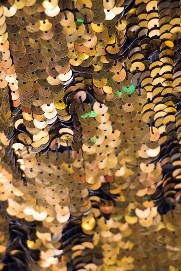 Vertical Shot of Cloth, Covered with Shiny and Gold-colored Spangles ...