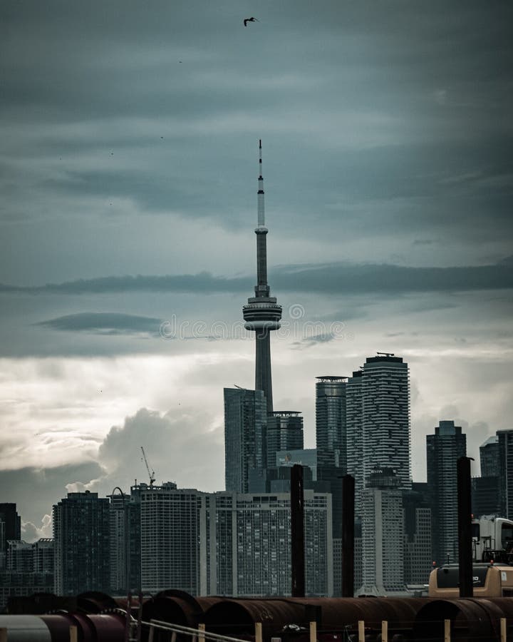 Vertical Shot of the CN Tower Under a Stormy Sky in Toronto, Canada ...