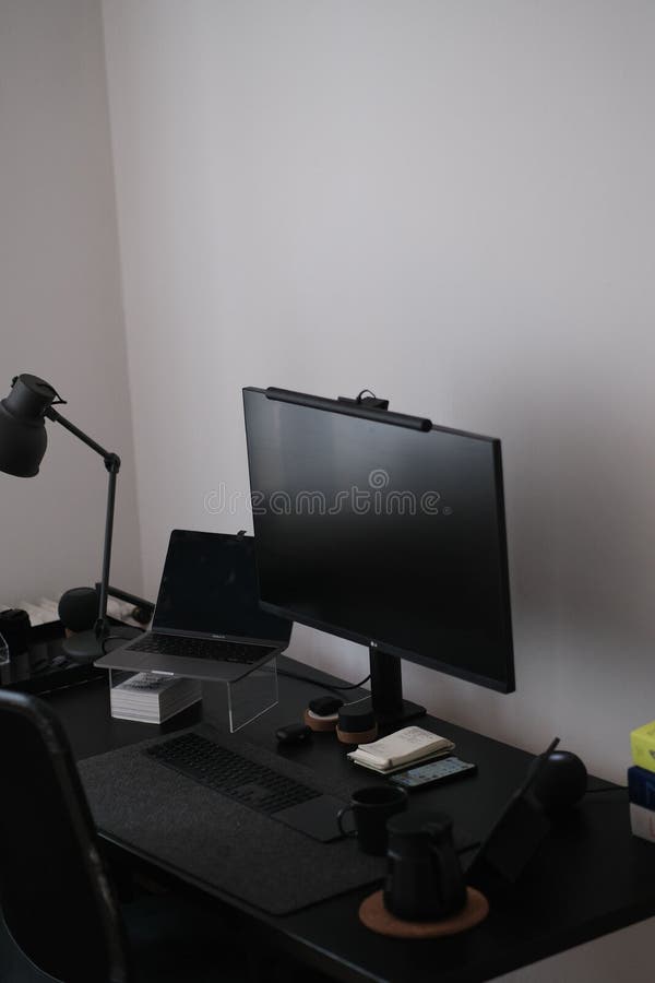 Vertical Shot of the Computer and Laptop on the Working Desk in a Home ...